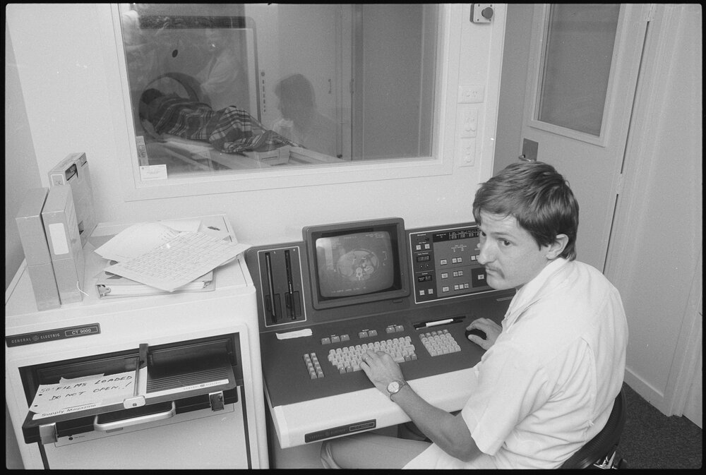 Unidentified Radiographer operating a CT scanner, Ipswich, July 1985 ...